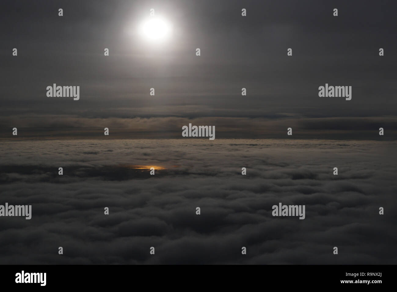 Sky with clouds at sunset from inside the plane landscape Stock Photo ...