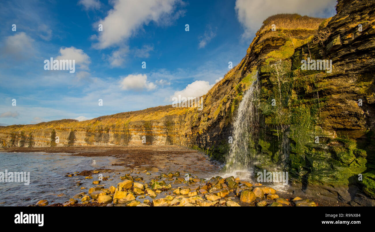 Waterfall from the cliffs at Kimmeridge Bay, Dorset, UK Stock Photo - Alamy