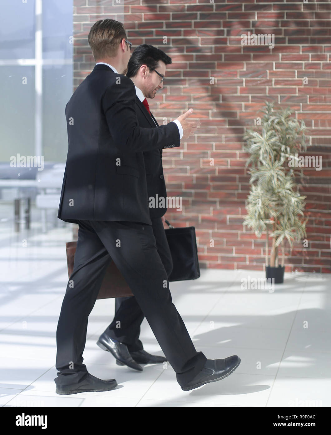 Bank employees standing in the office Stock Photo - Alamy