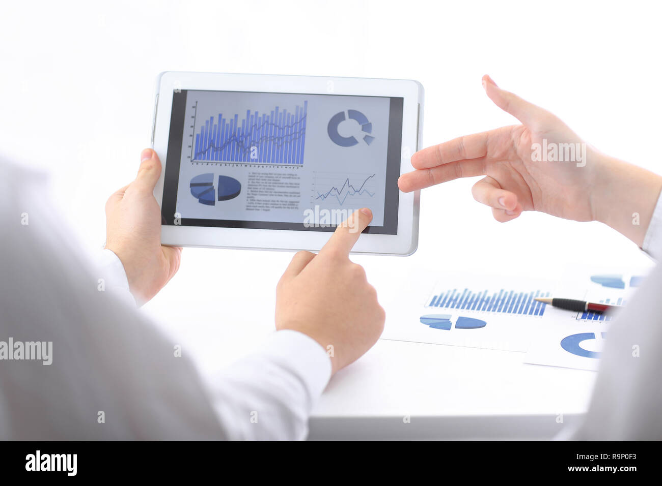 businessman pointing with pen on a digital tablet screen Stock Photo ...