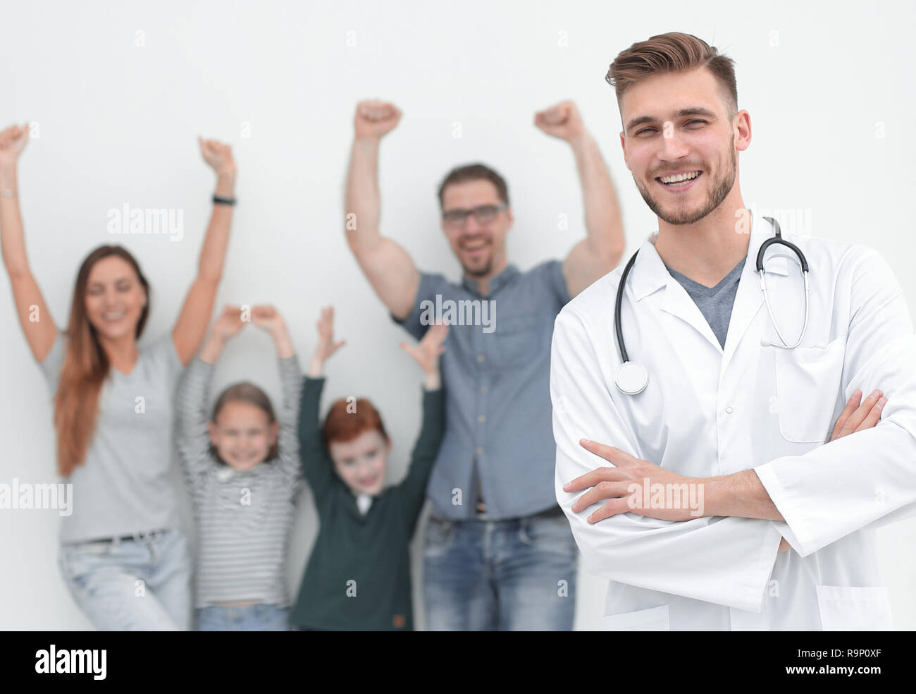 portrait of a family doctor on the background of his happy patie Stock ...