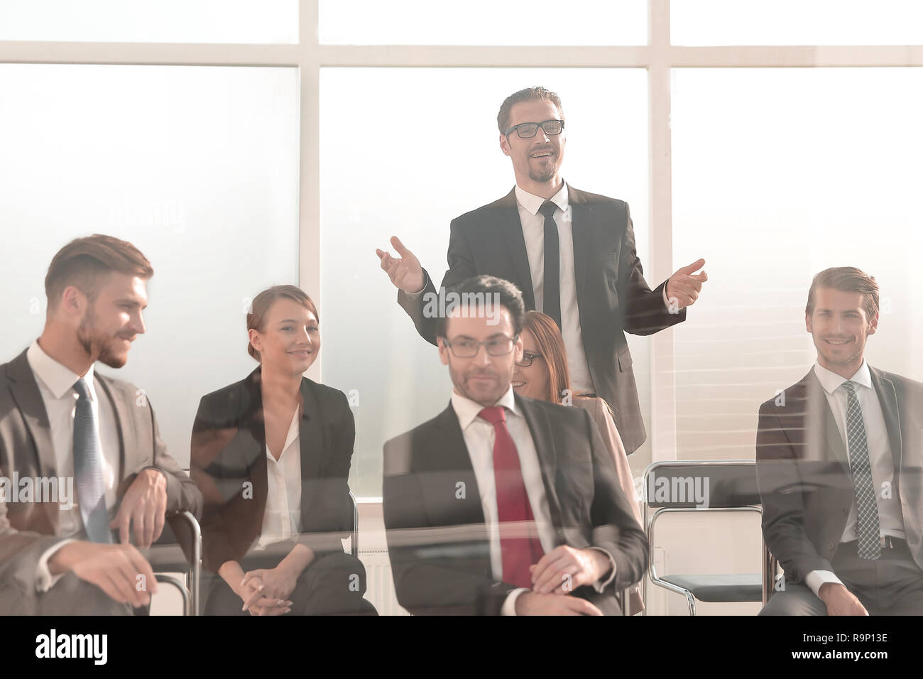 Woman addressing group of men hi-res stock photography and images - Alamy