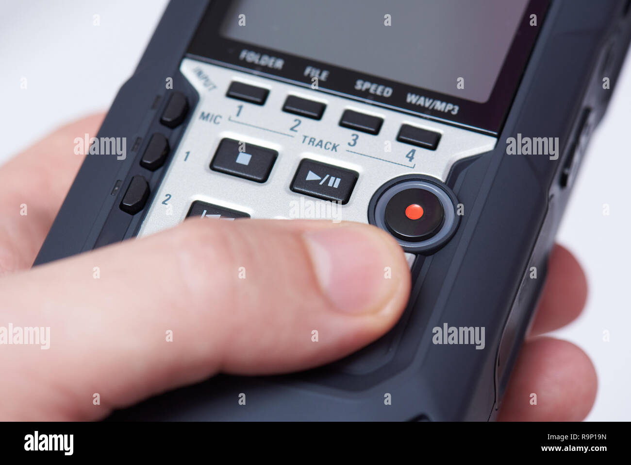 Audiorecorder in hand close up isolated on white background Stock Photo ...