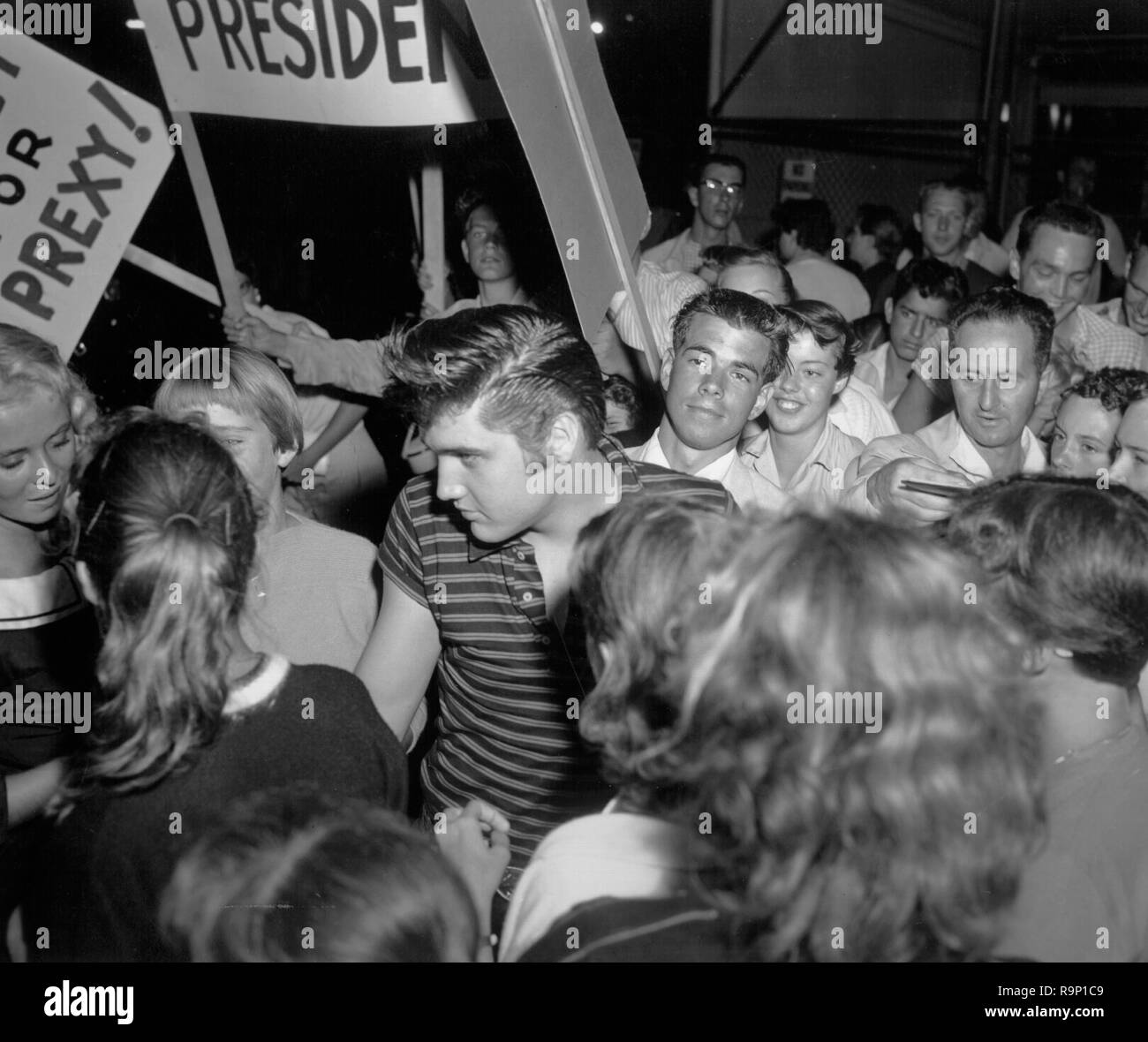Elvis Presley, signs autographs for fans in Los Angeles, CA, circa 1957 ...