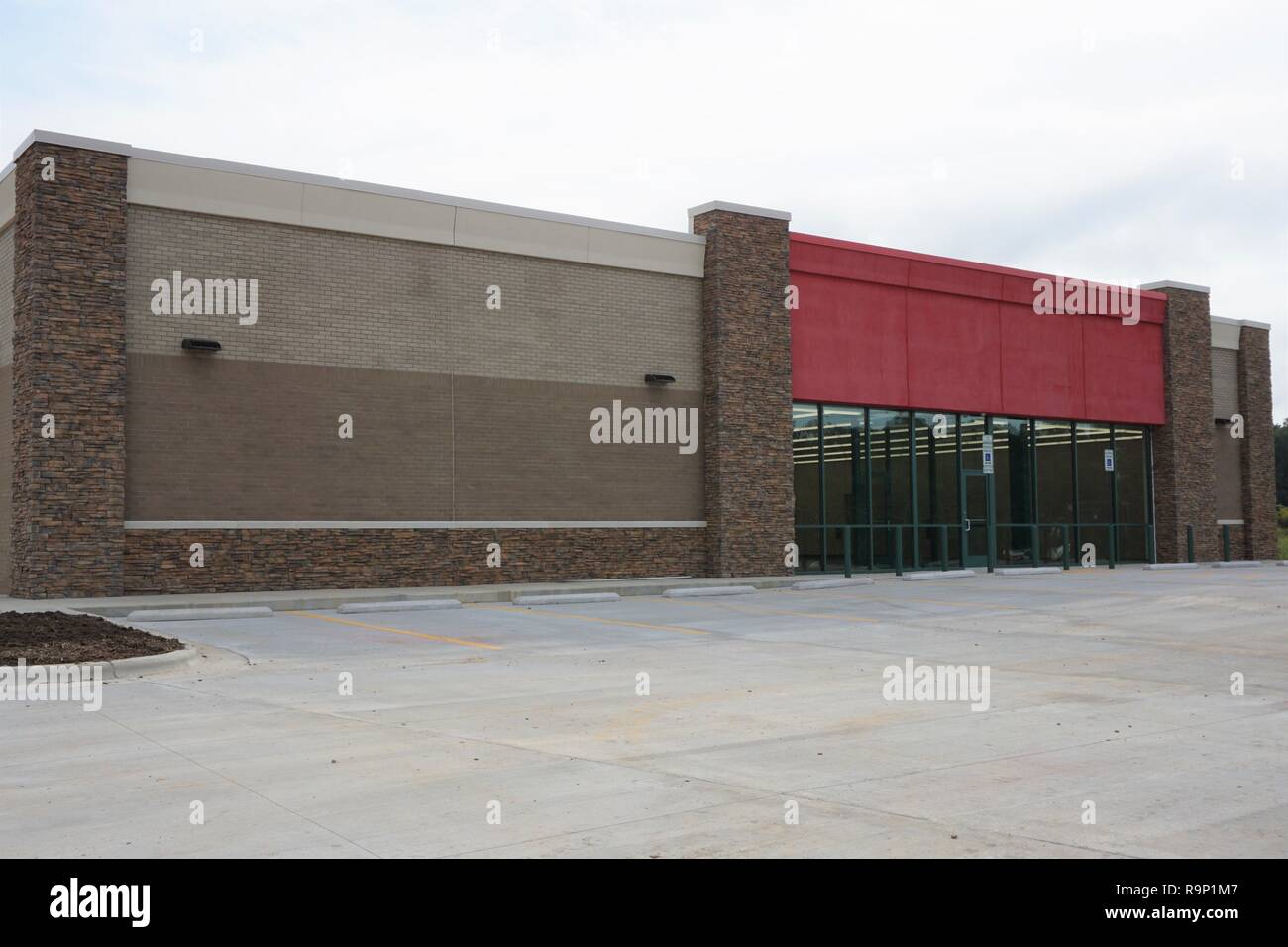 New construction store front with blank signage Stock Photo - Alamy