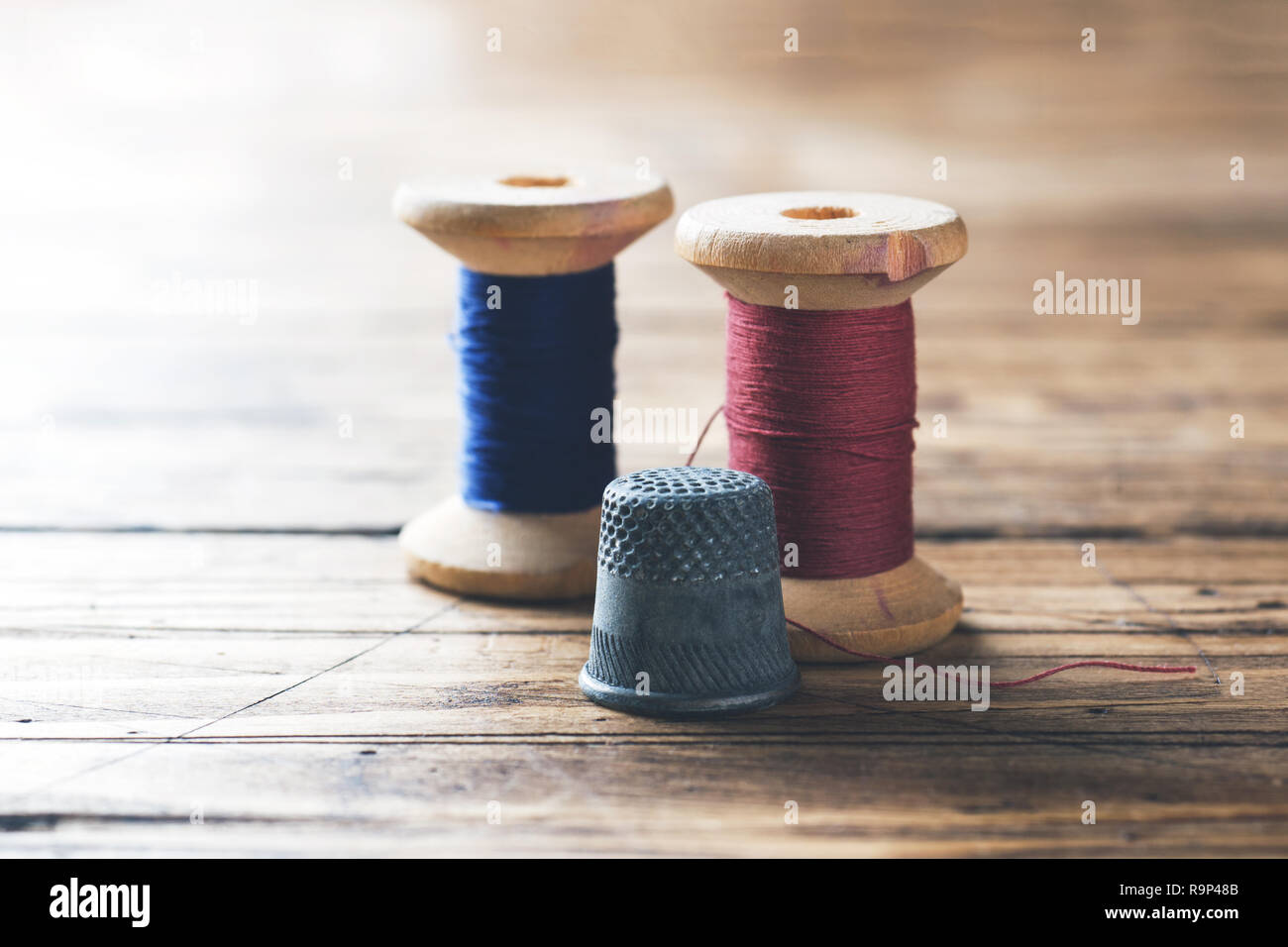 Wooden reel of thread hi-res stock photography and images - Alamy