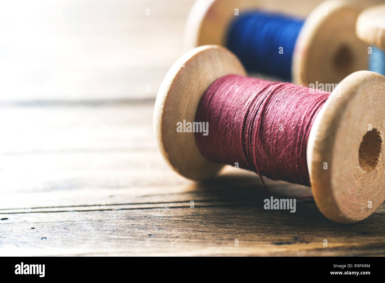 Wooden spools of thread close-up. Selective focus. Rendered image Copy ...