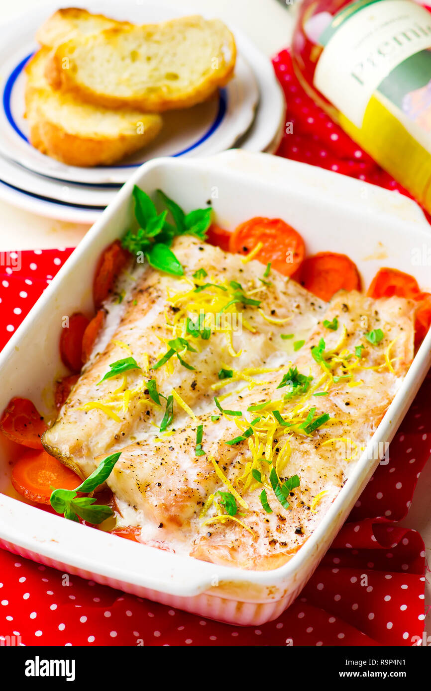 The baked fish fillet with carrot and basil . selective focus Stock ...