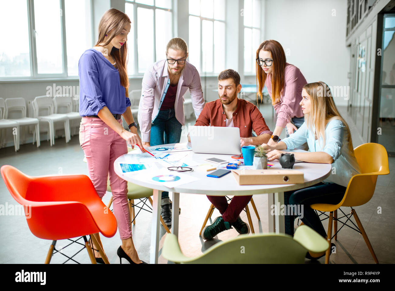 Group of a young coworkers dressed casually working together with ...