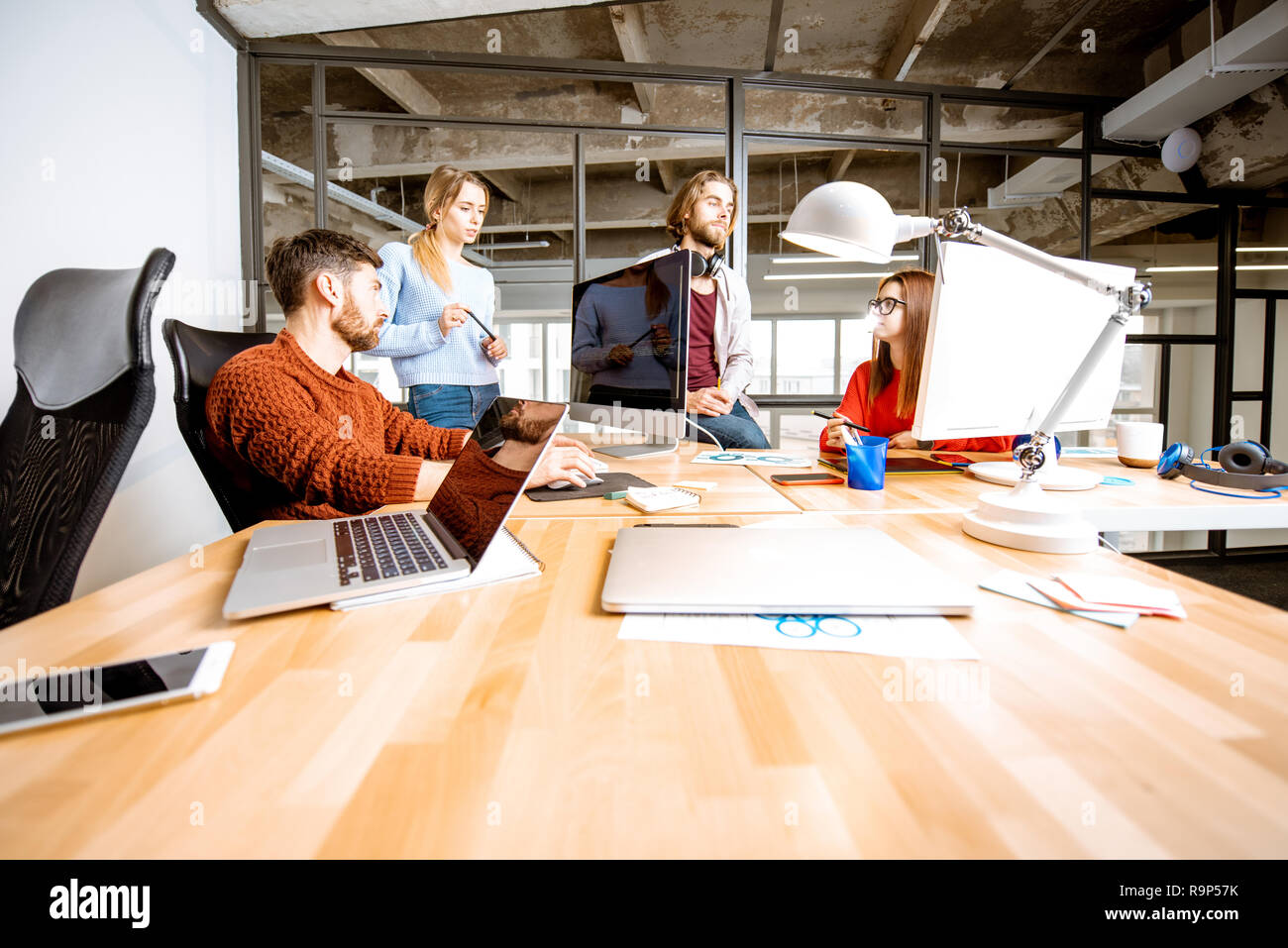 Group of young coworkers dressed casually working together on the ...