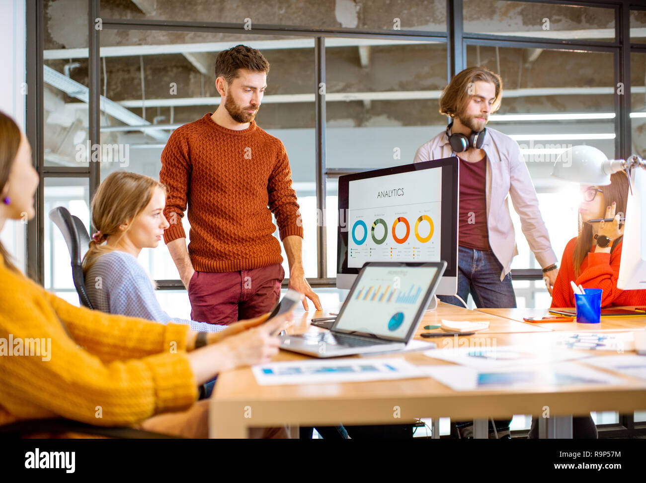 Group of young coworkers dressed casually working together on the ...