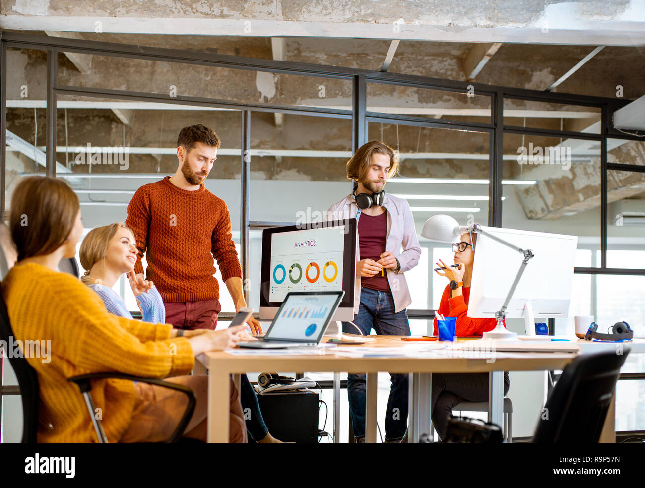 Group of young coworkers dressed casually working together on the ...
