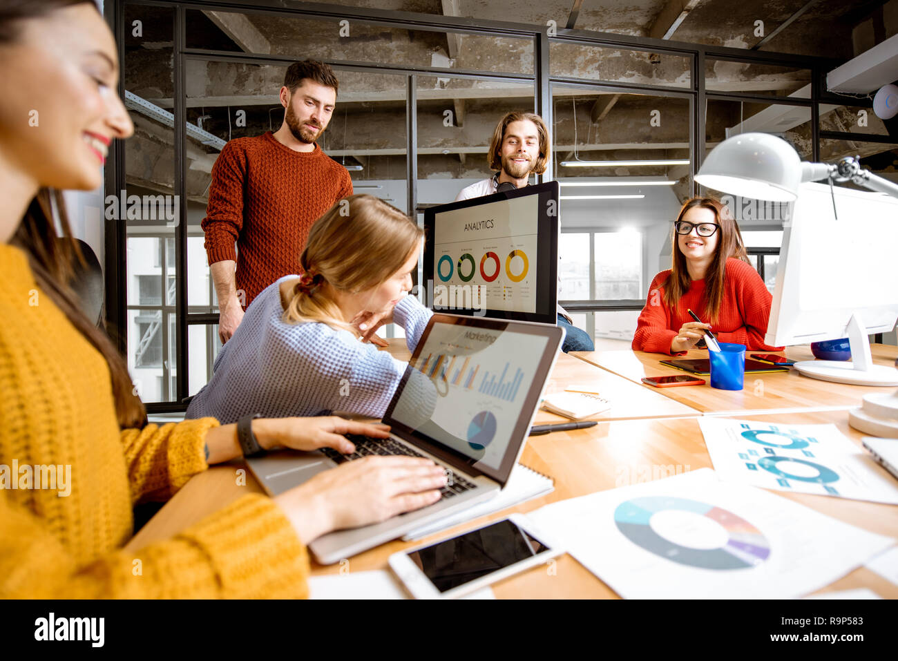 Group of young coworkers dressed casually working together on the ...