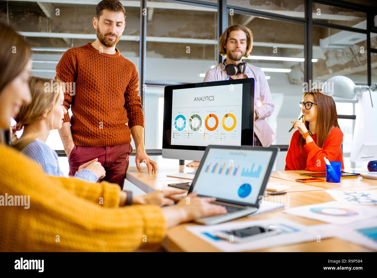 Group of young coworkers dressed casually working together on the ...