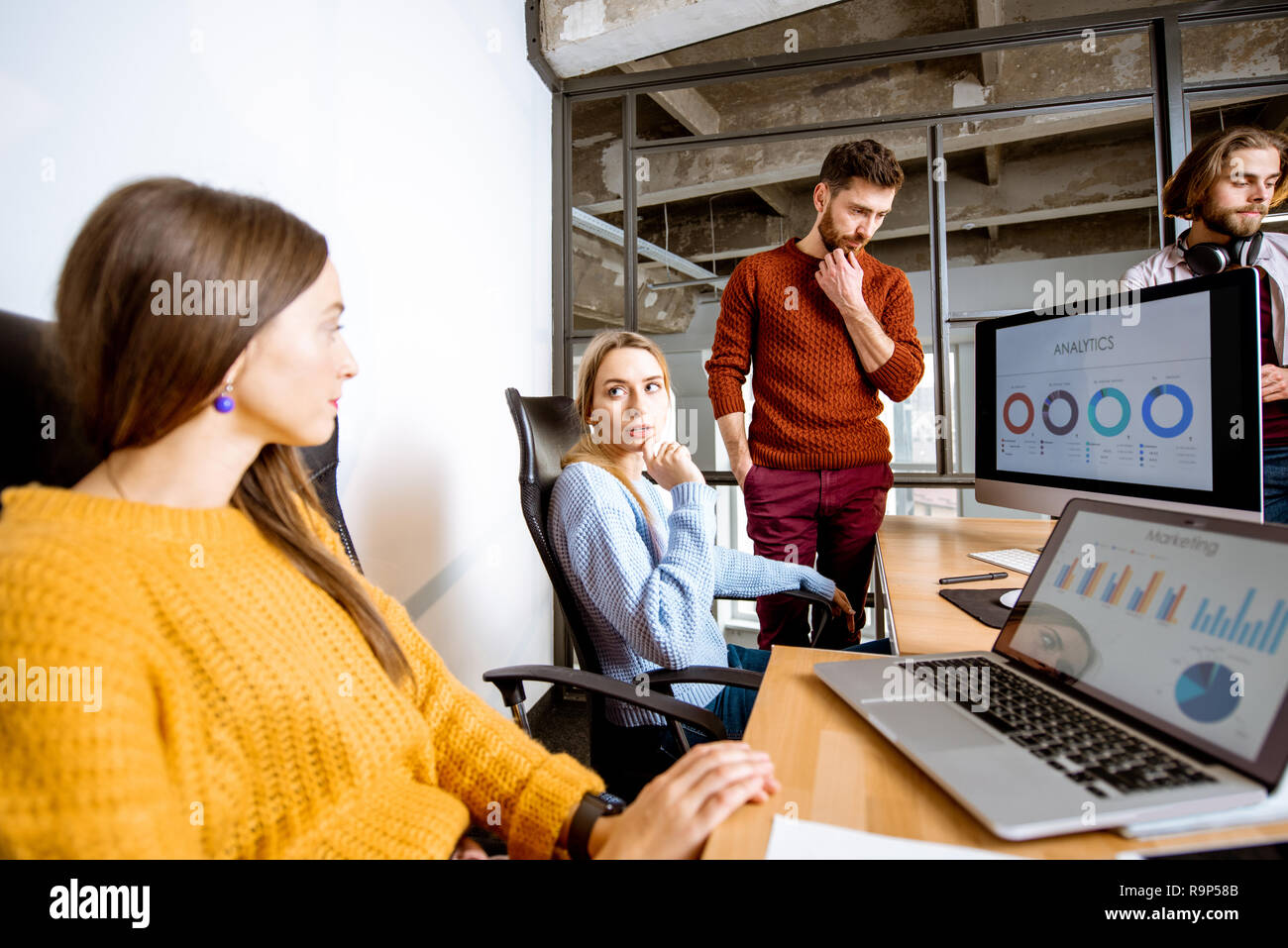 Group of young coworkers dressed casually working together on the ...
