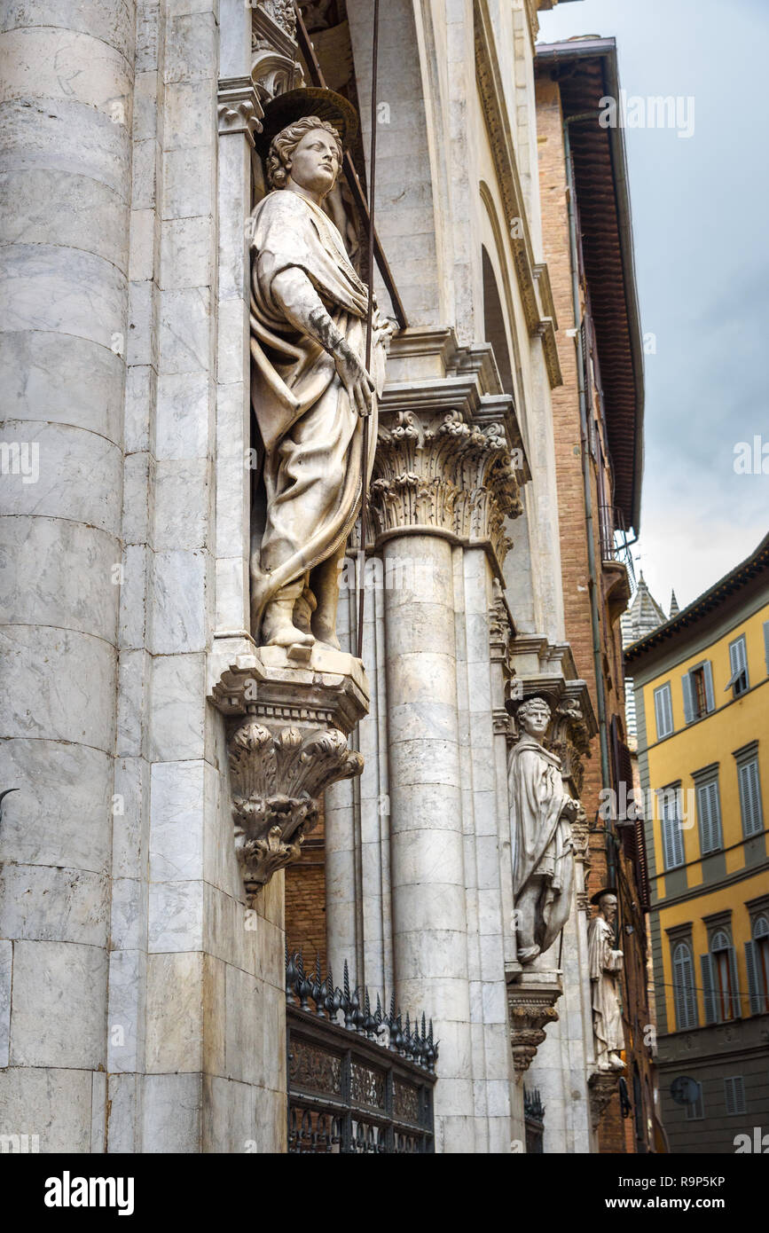 Statue of Saint Ansanus. Statues decorating facade of Loggia della ...