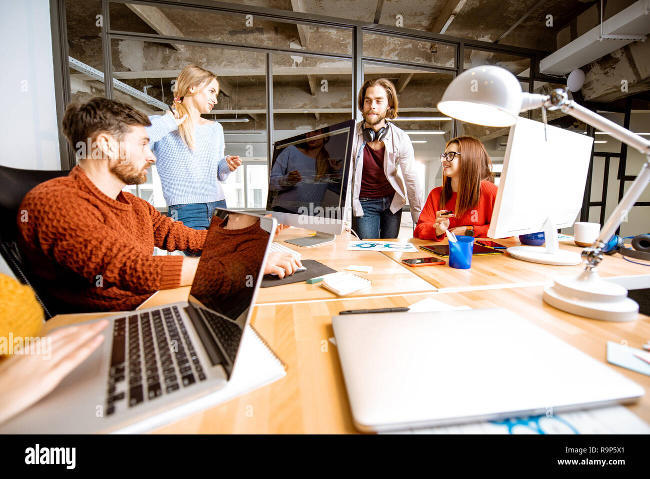Group of young coworkers dressed casually working together on the ...