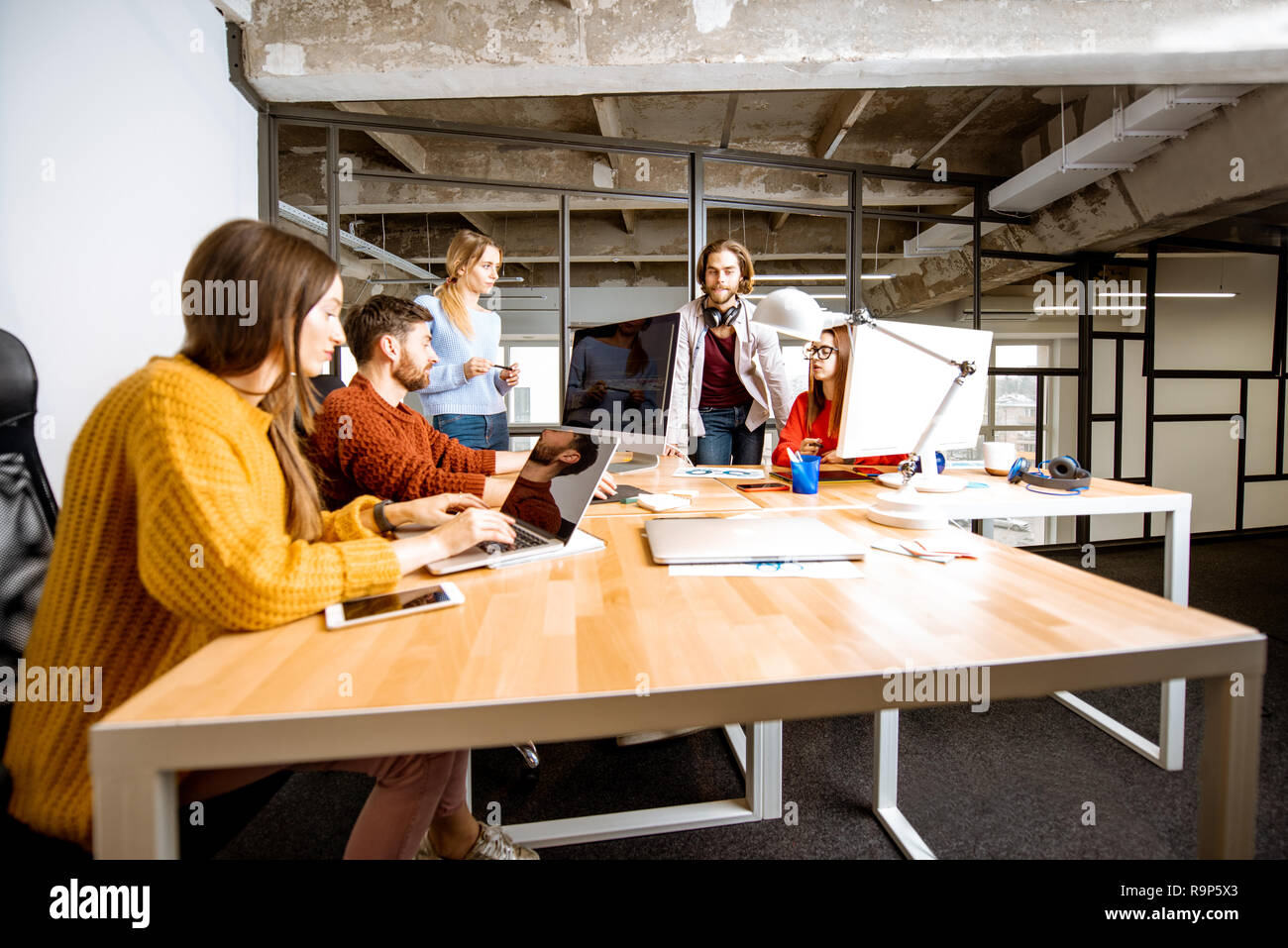 Group of young coworkers dressed casually working together on the ...