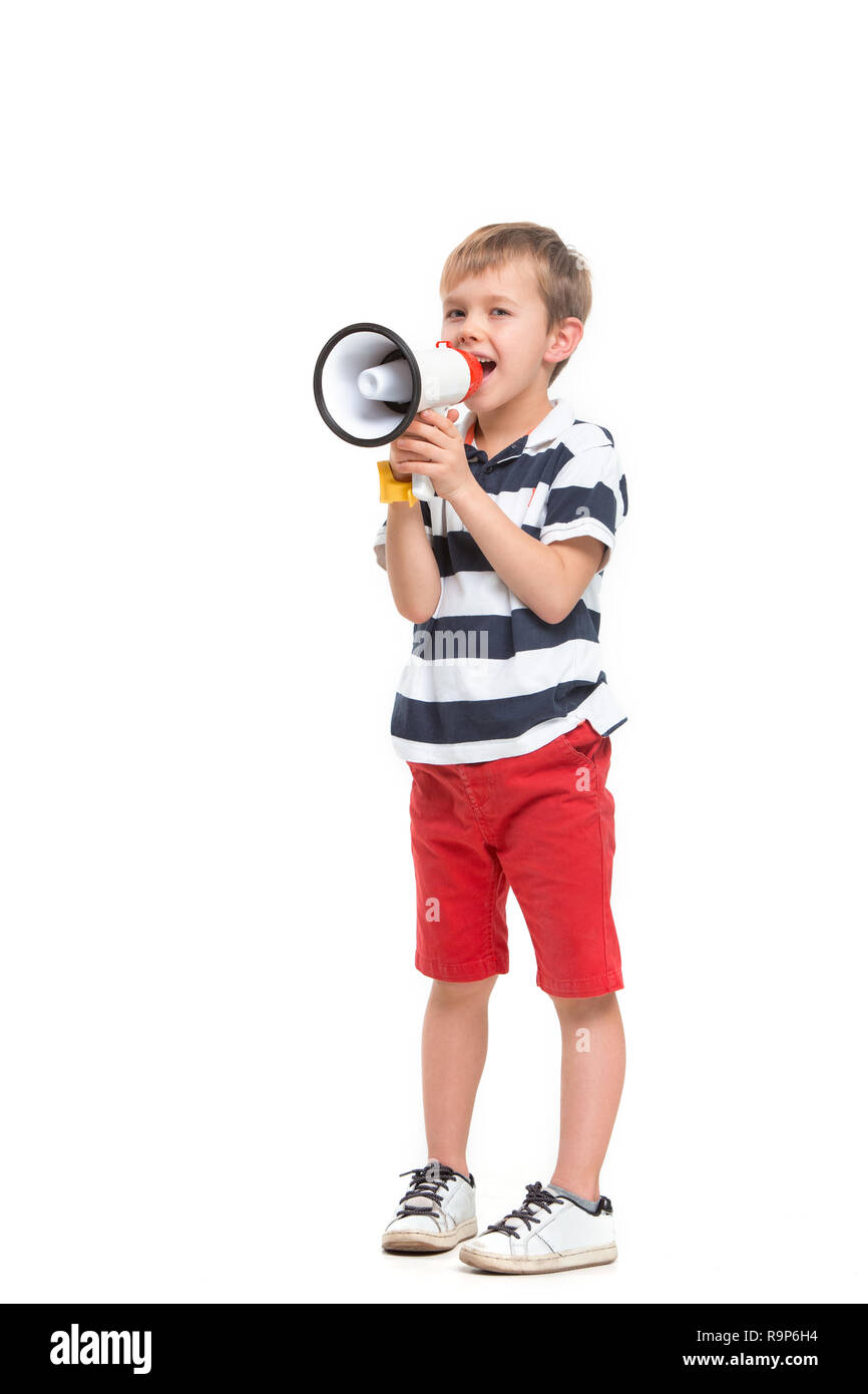 Little cute kid baby boy holding in hand and speaking in electronic ...