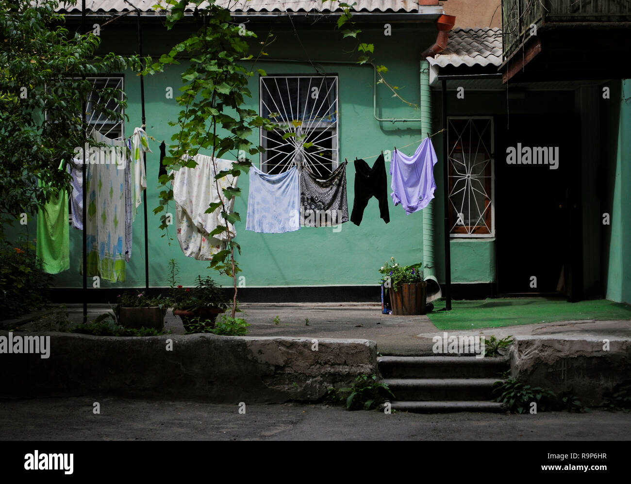 Interior of a typical yard of a house with laundry clothes drying ...