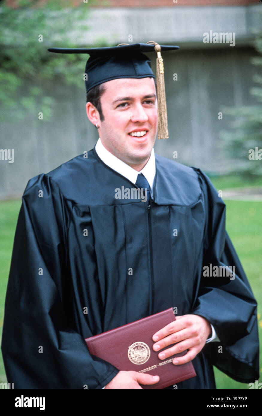 Happy male college graduate is holding his diploma, USA Stock Photo - Alamy