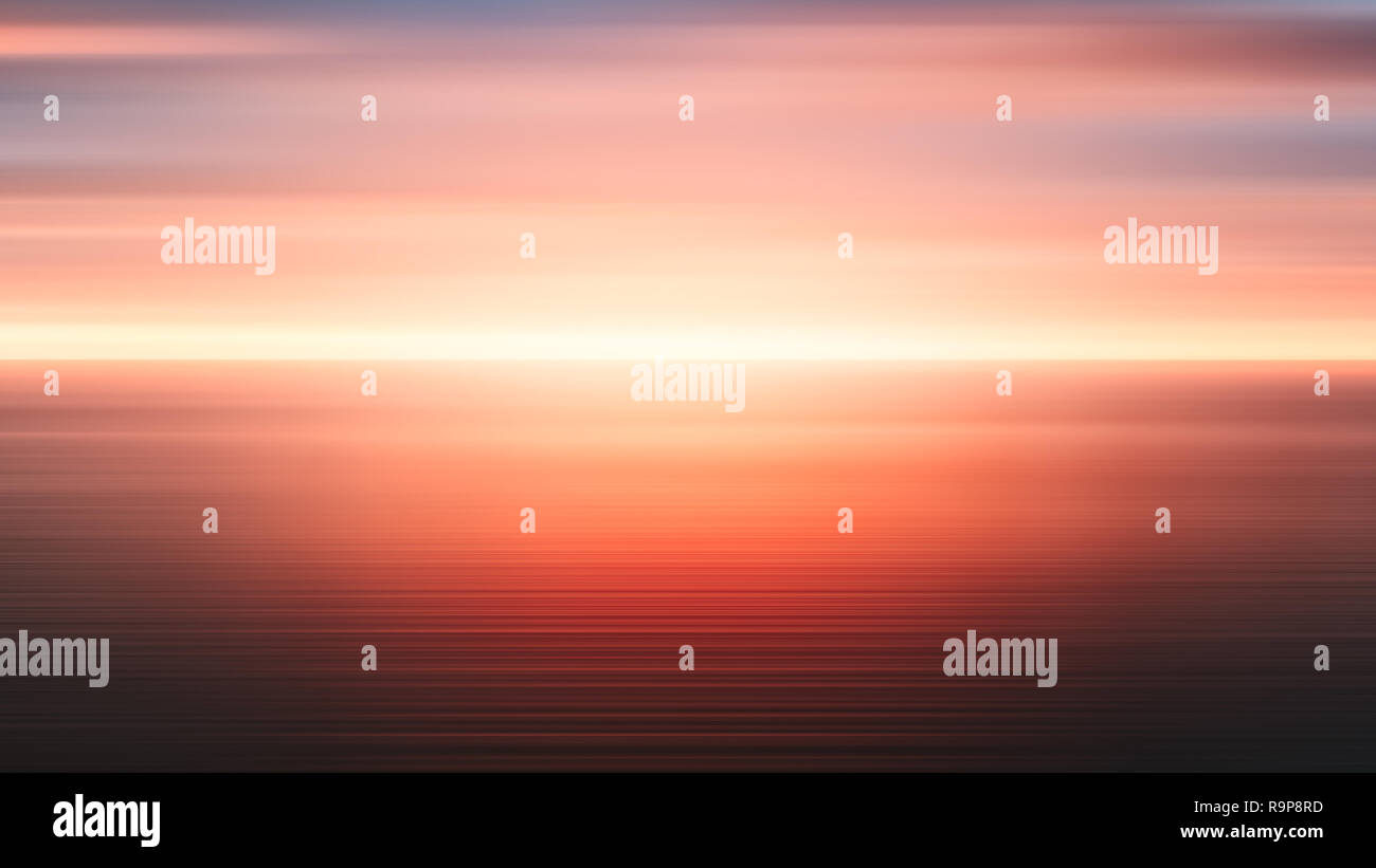 Abstract sunrise background of sea and cloudy sky over it. Motion blur ...