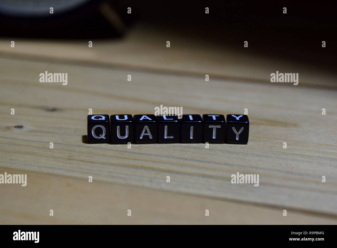 Quality written on wooden blocks. Education and business concept on ...