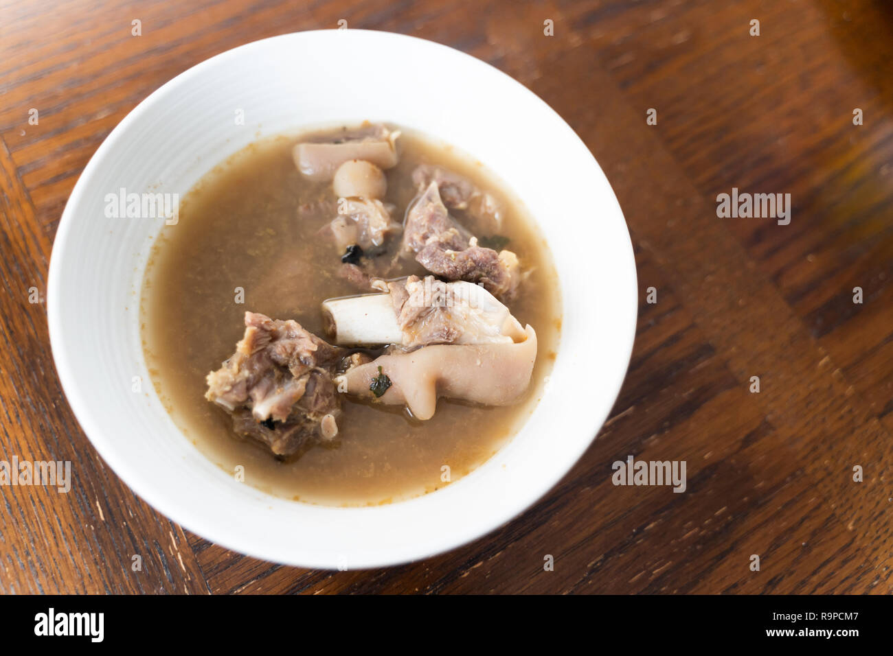 Nigerian Goat Meat Pepper soup served in a white bowl Stock Photo - Alamy