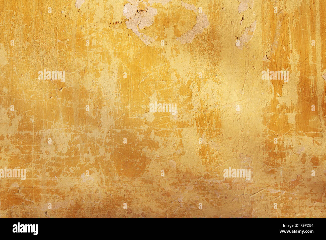 Grunge background - texture stucco of ochre color Stock Photo - Alamy