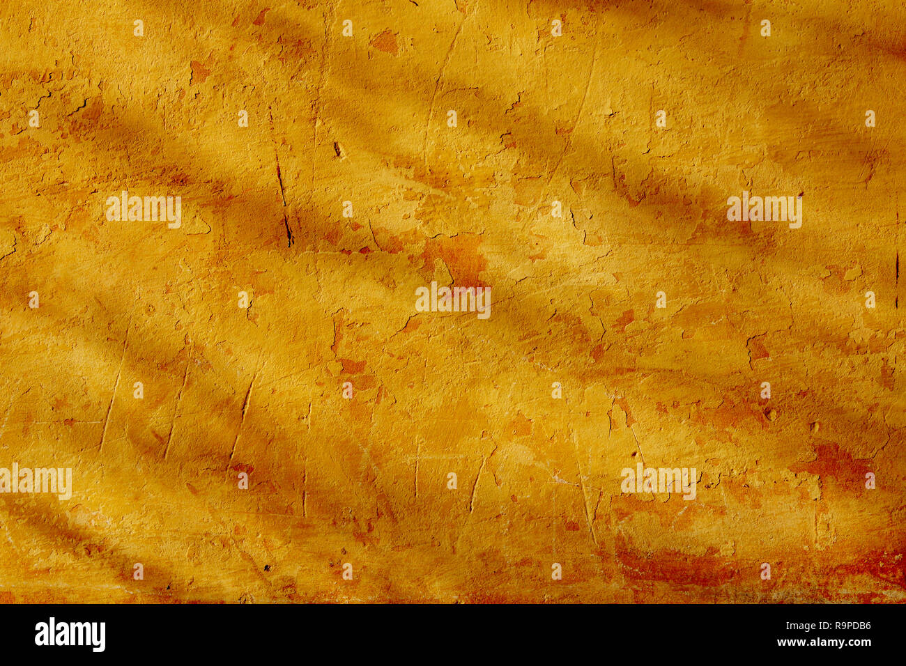 Grunge background - texture stucco of ochre color Stock Photo - Alamy