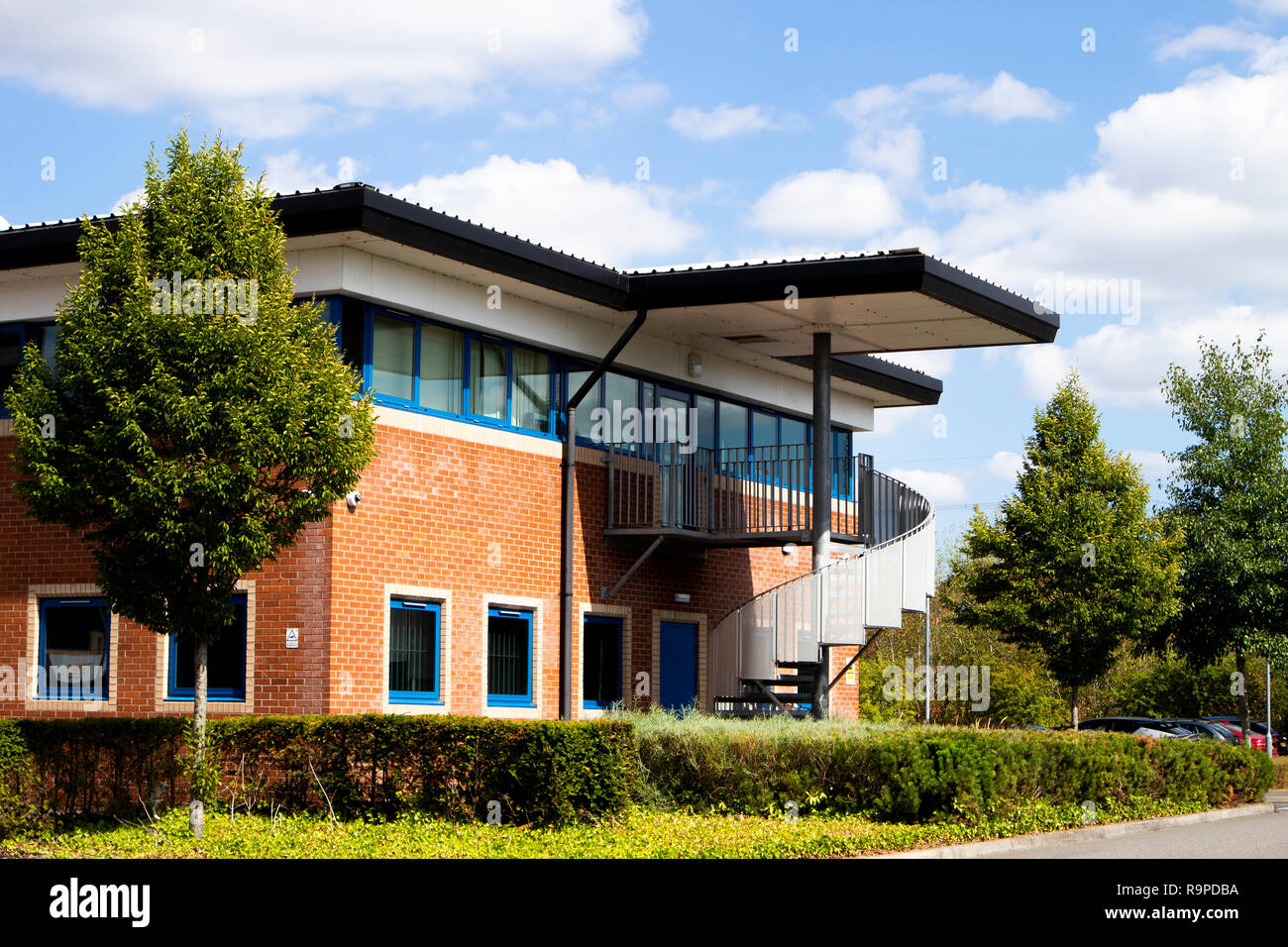 spiral steel emergency exit fire escape to side of office building ...