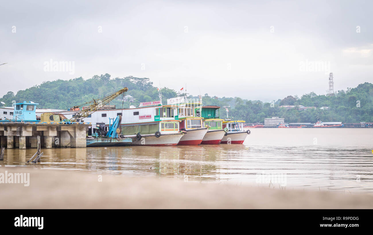 wooden boats docked on small port in Mahakam river, Samarinda ...