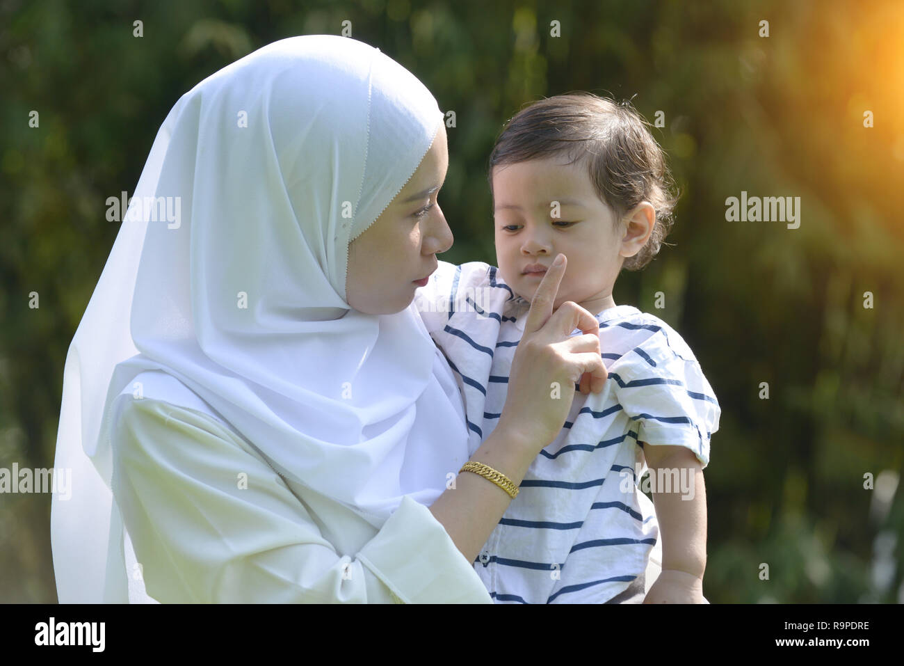 malay muslim mother and child Stock Photo - Alamy