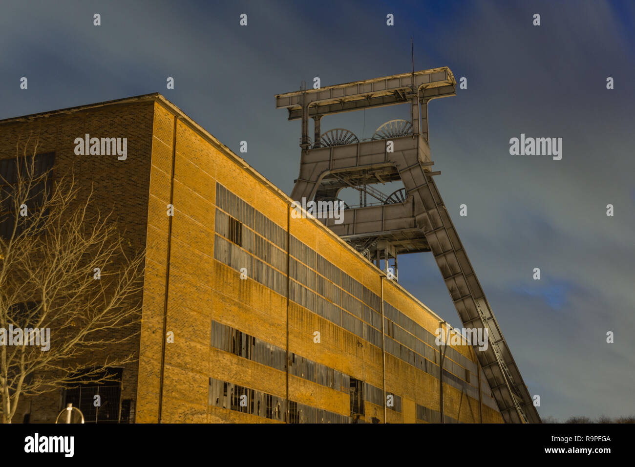 A mine shaft tower at sunset Stock Photo - Alamy