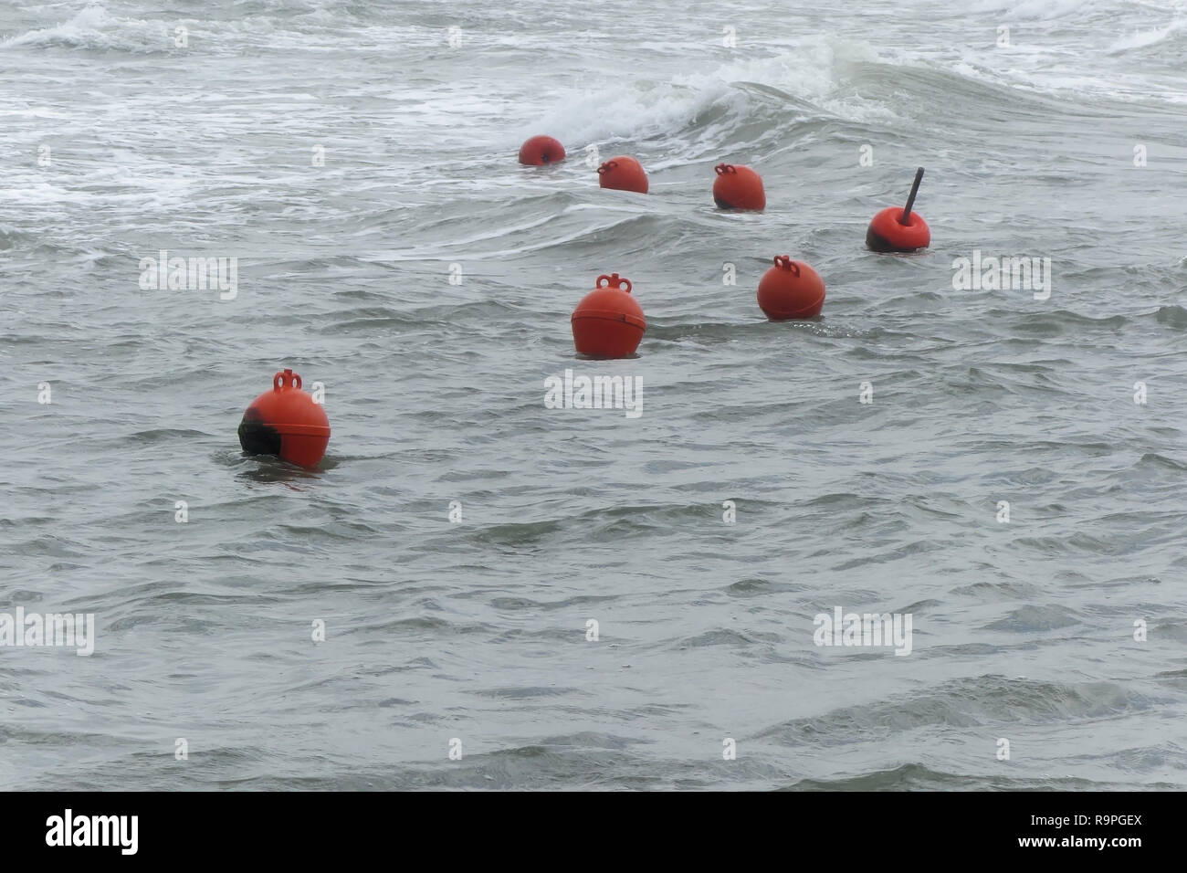 buoys floating in rough sea Stock Photo - Alamy