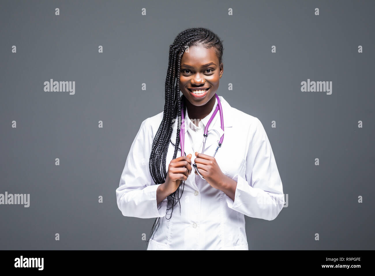 Pretty african american female intern nurse isolated on white ...