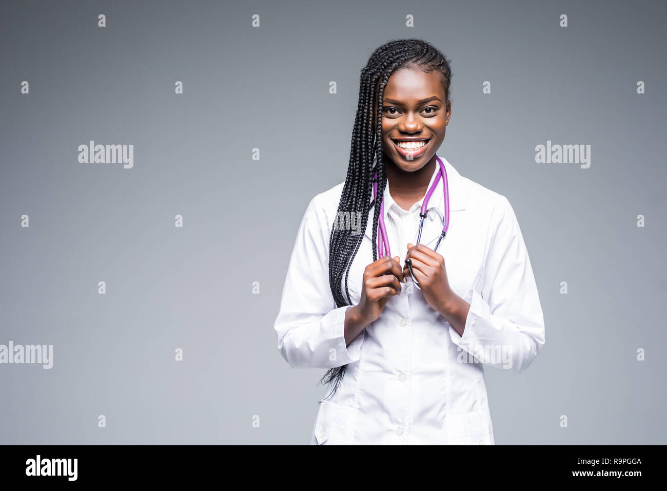 Pretty african american female intern nurse isolated on white ...