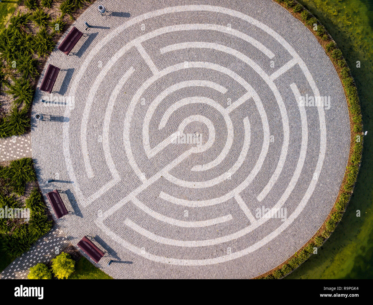 Decorative labyrinth in the yard. Picture of the maze on the road top ...