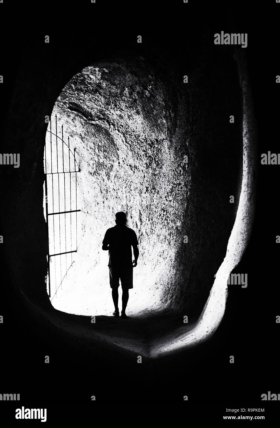 Man in a cave Stock Photo - Alamy