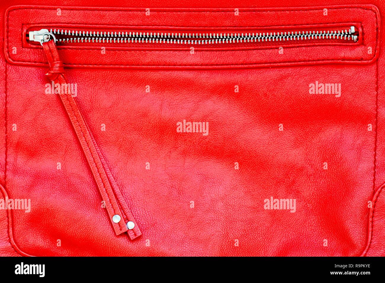 Red leather bag purse with pocket open zipper binding together two ...