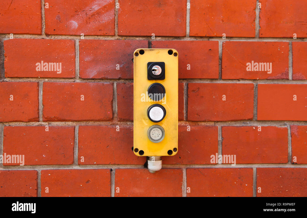 Industrial yellow switch box with power on and off switches buttons and ...