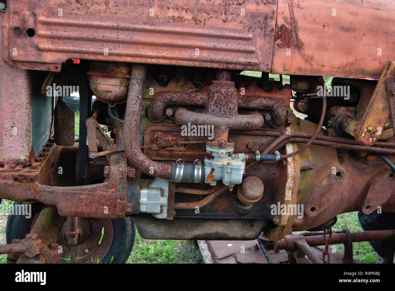 Old rusty red iron farmer's tractor Stock Photo - Alamy