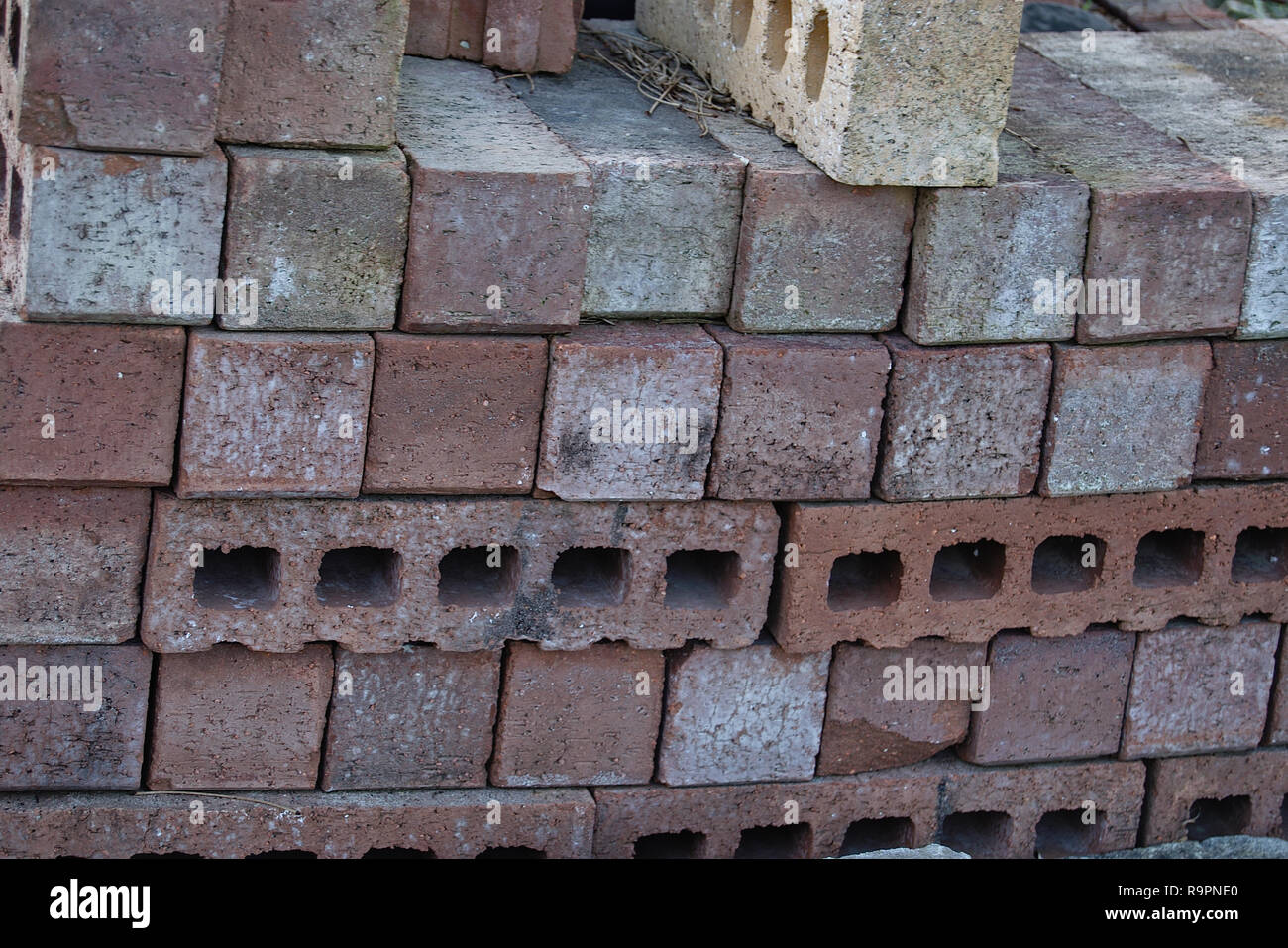 A stack of bricks and cement pavers Stock Photo - Alamy