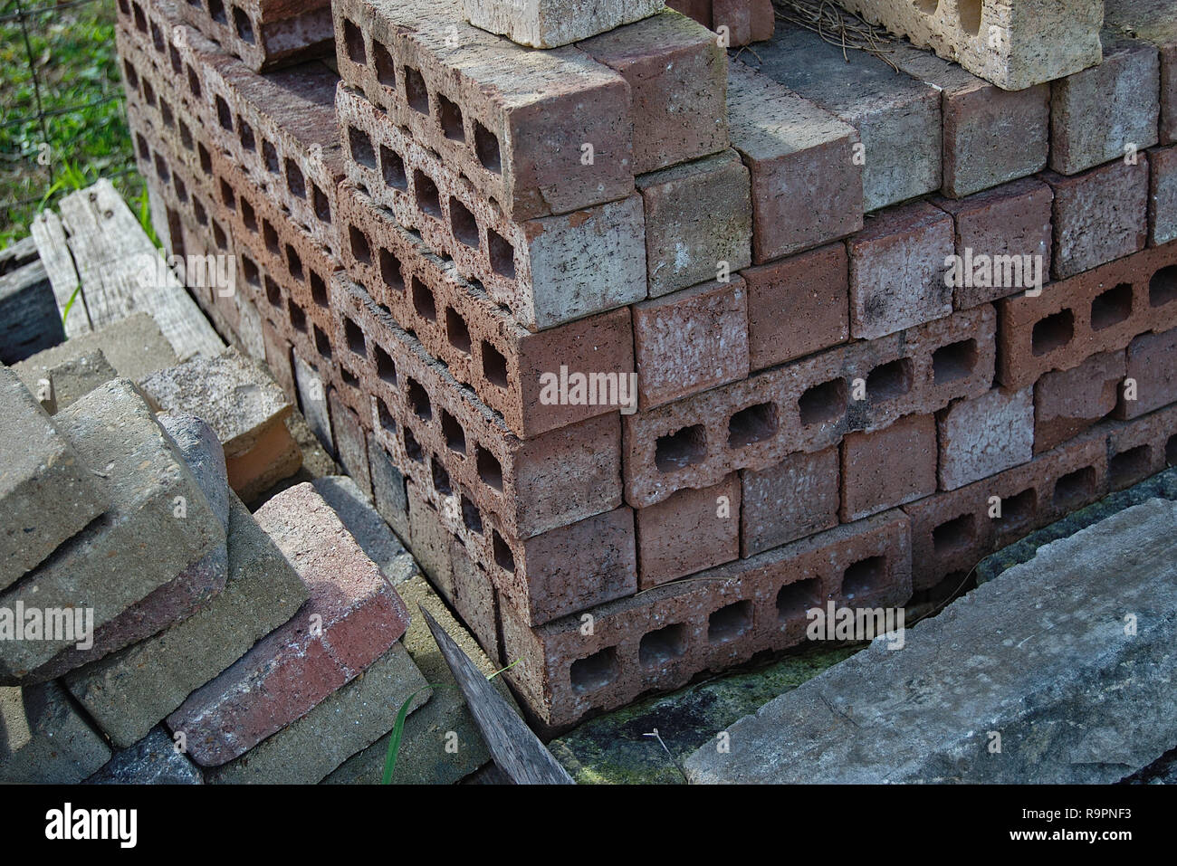 A stack of bricks and cement pavers Stock Photo - Alamy