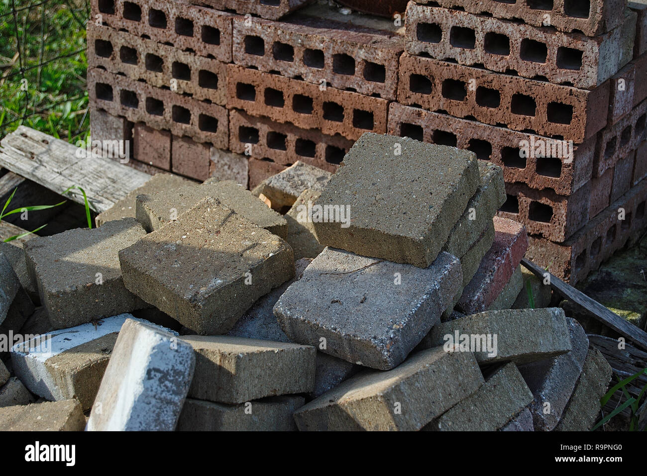 A stack of bricks and cement pavers Stock Photo - Alamy