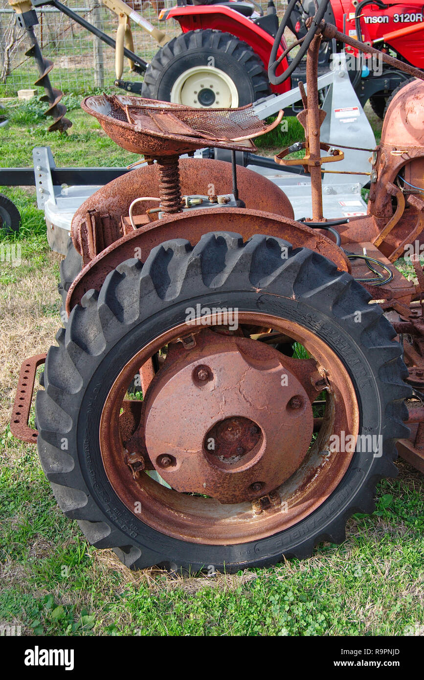 Old rusty red iron farmer's tractor Stock Photo - Alamy