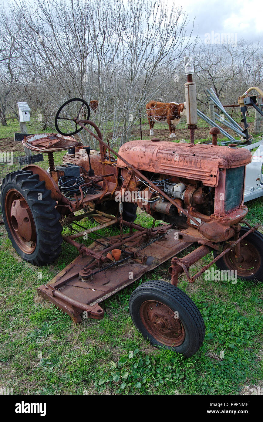 Old rusty red iron farmer's tractor Stock Photo - Alamy