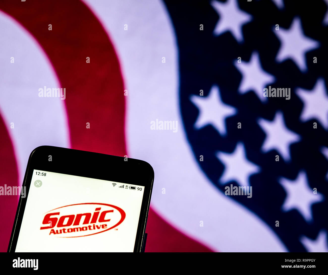 Sonic Automotive Automobile company logo seen displayed on smart phone ...