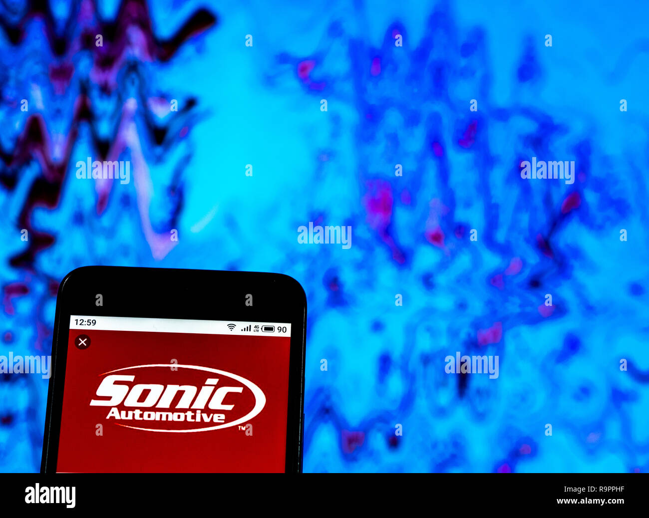 Sonic Automotive Automobile company logo seen displayed on smart phone ...