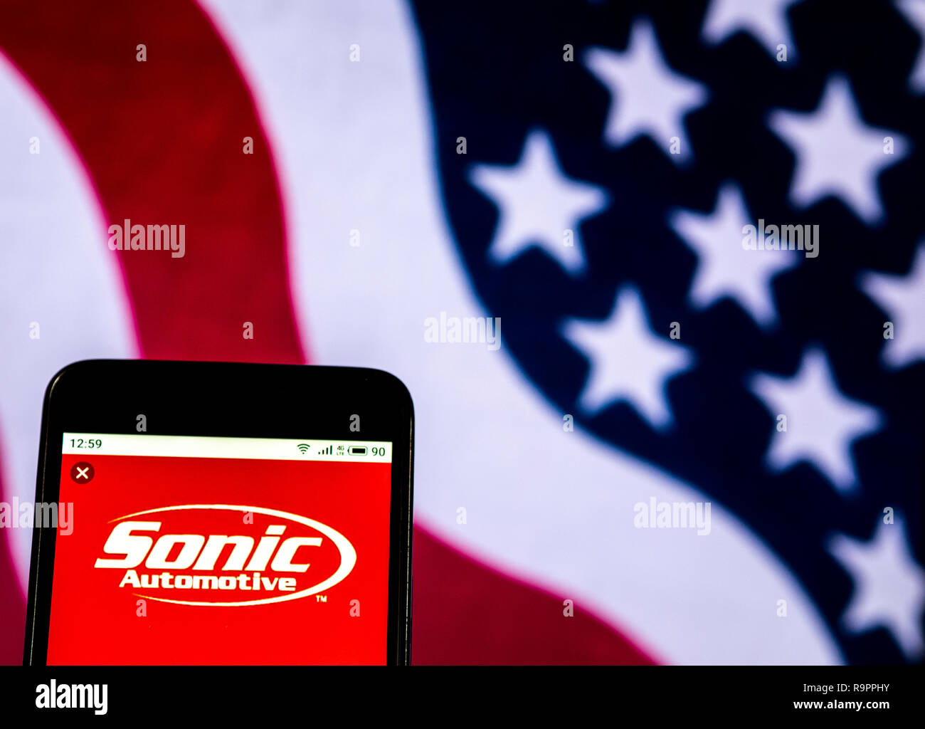 Sonic Automotive Automobile company logo seen displayed on smart phone ...